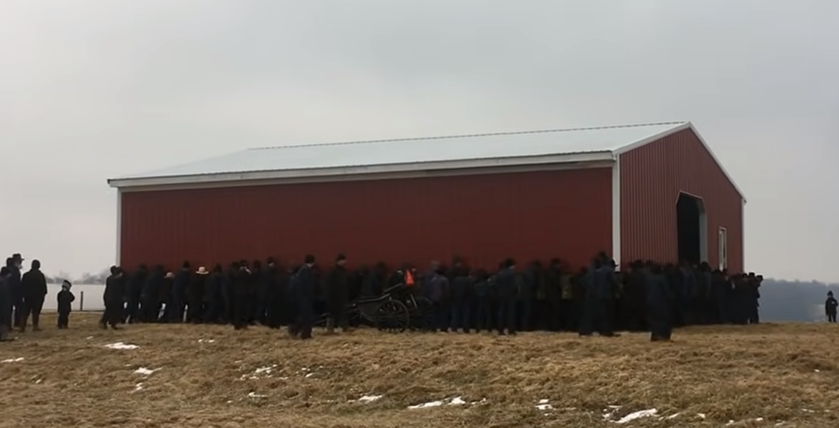 Watch 250 Amish Men Come Together to Move a Barn With Their Bare Hands