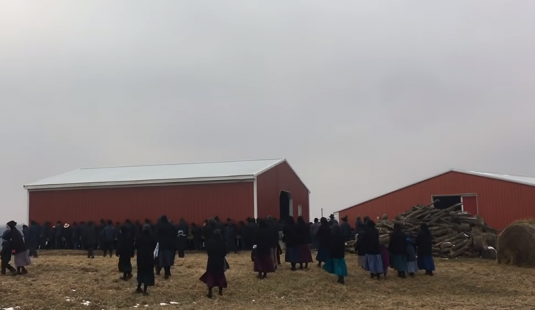 Watch 250 Amish Men Come Together to Move a Barn With Their Bare Hands